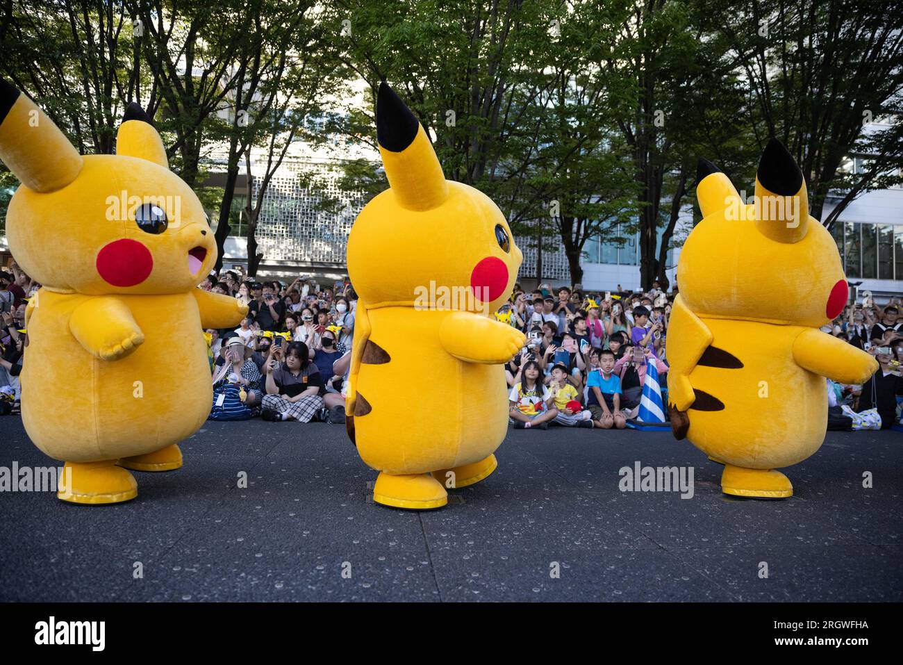 Yokohama, Japan. 11th Aug, 2023. Pikachus walk and dance in front of ...