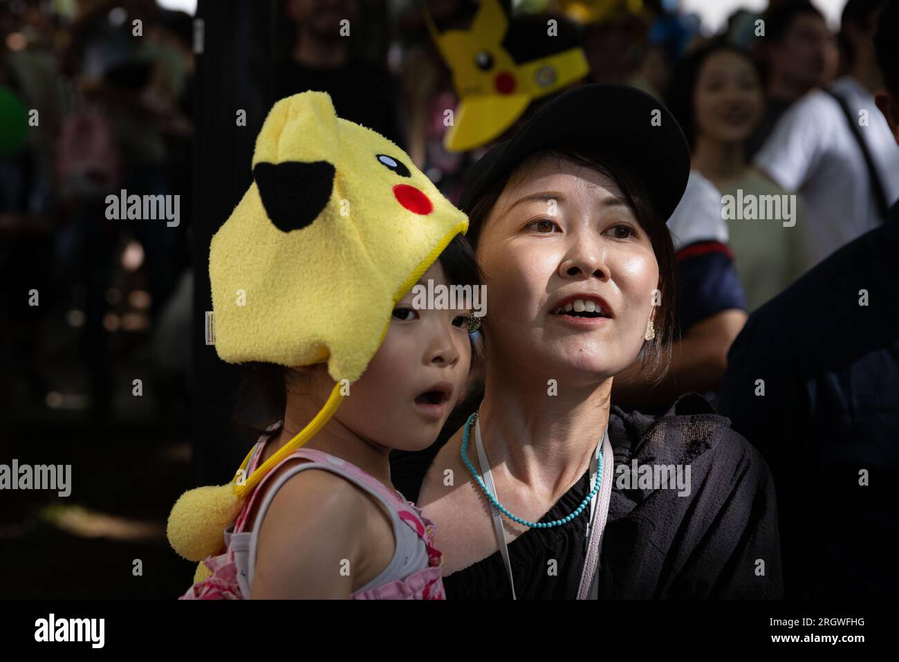 Yokohama, Japan. 11th Aug, 2023. Mother and daughter watch the Pikachu ...