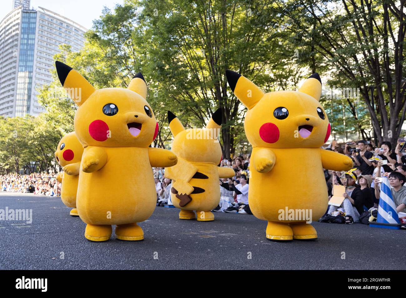 Yokohama, Japan. 11th Aug, 2023. Pikachus walk and dance in front of ...