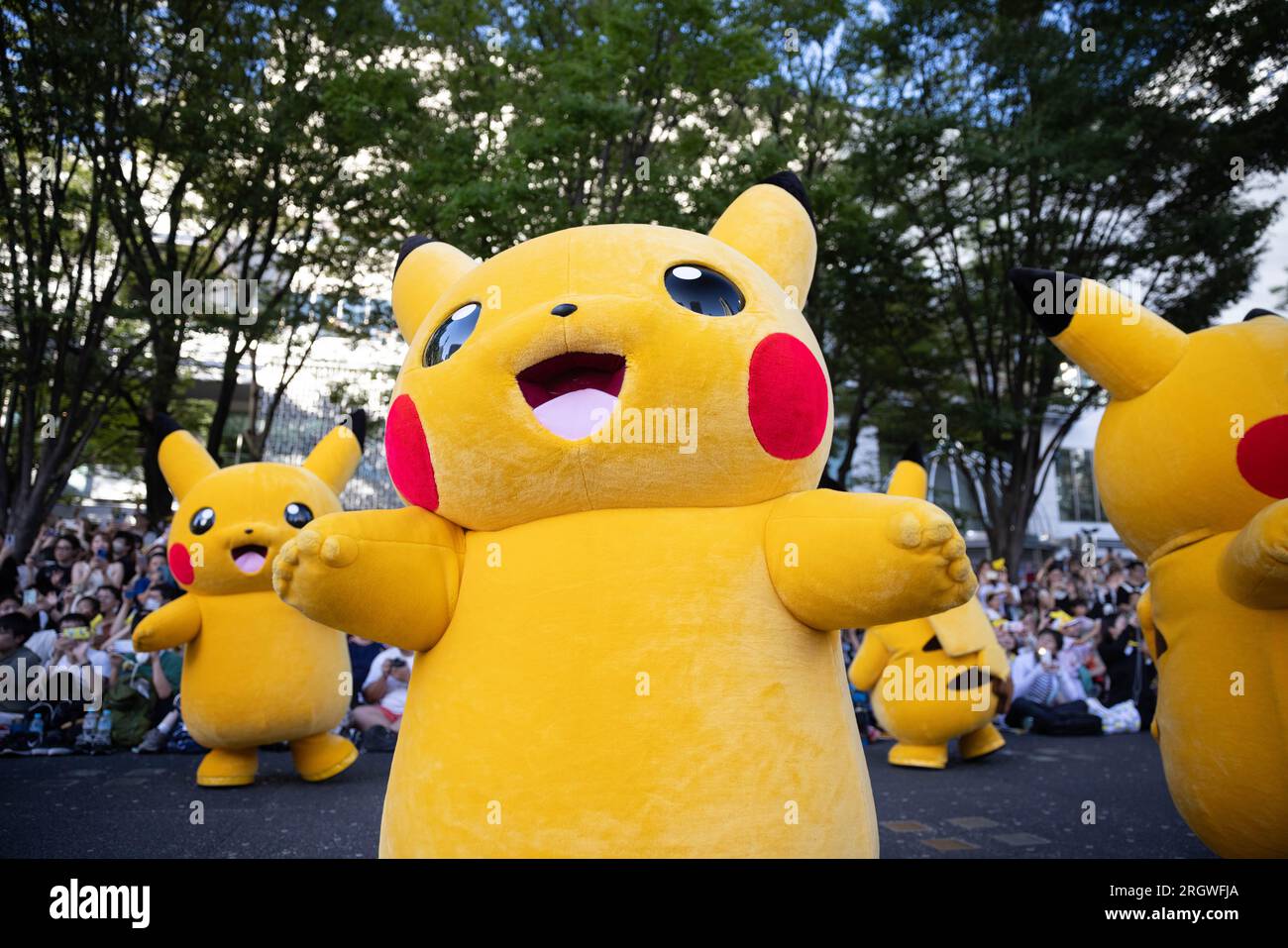 Yokohama, Japan. 11th Aug, 2023. Pikachus walk and dance in front of ...