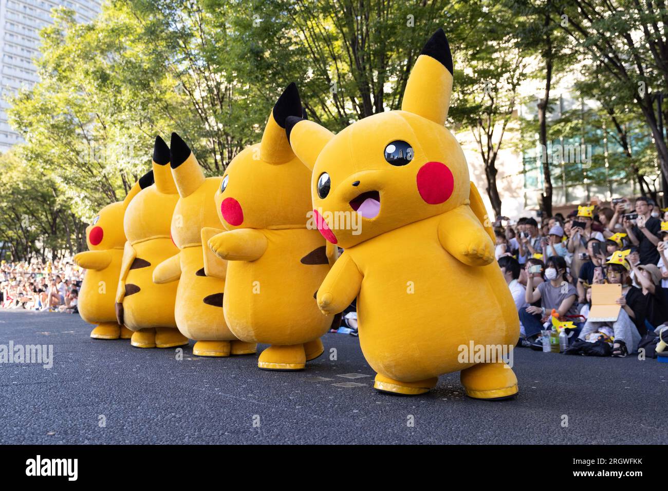 Yokohama, Japan. 11th Aug, 2023. Pikachus walk and dance in front of ...