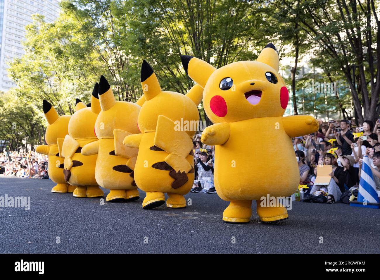 Yokohama, Japan. 11th Aug, 2023. Pikachus walk and dance in front of ...