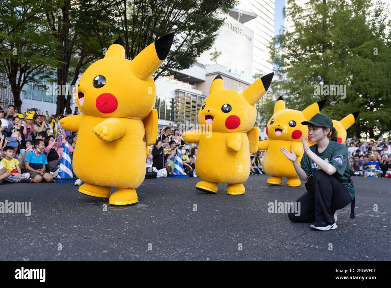 Yokohama, Japan. 11th Aug, 2023. Pikachus walk and dance in front of ...