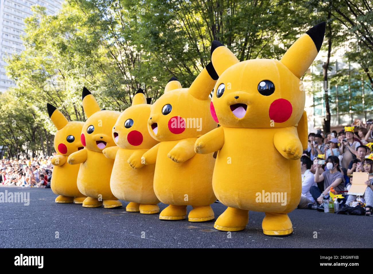 Yokohama, Japan. 11th Aug, 2023. Pikachus walk and dance in front of ...