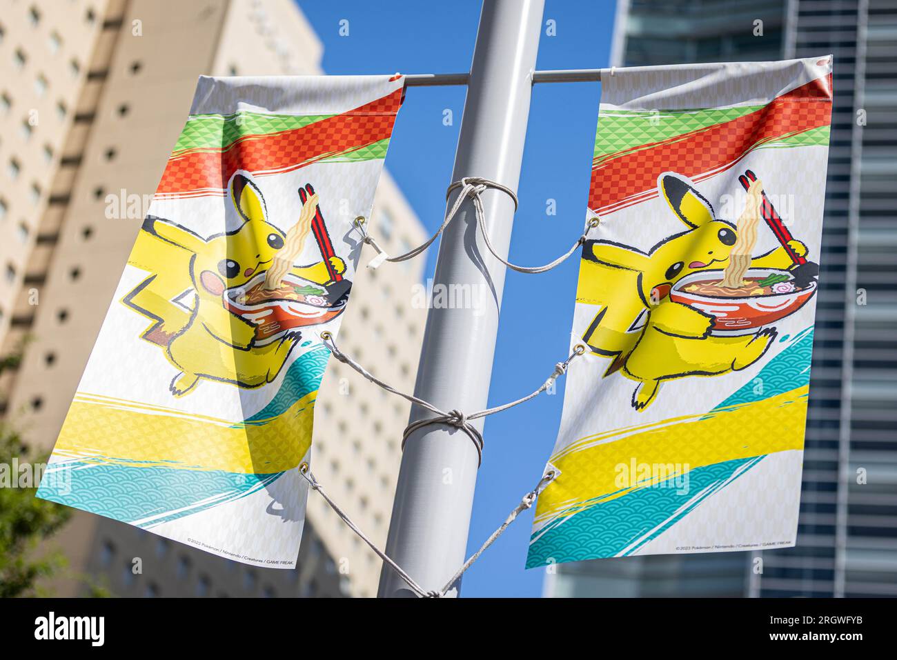 Yokohama, Japan. 11th Aug, 2023. Decorative flag of Pikachu eating a bowl of Ramen displayed in ...