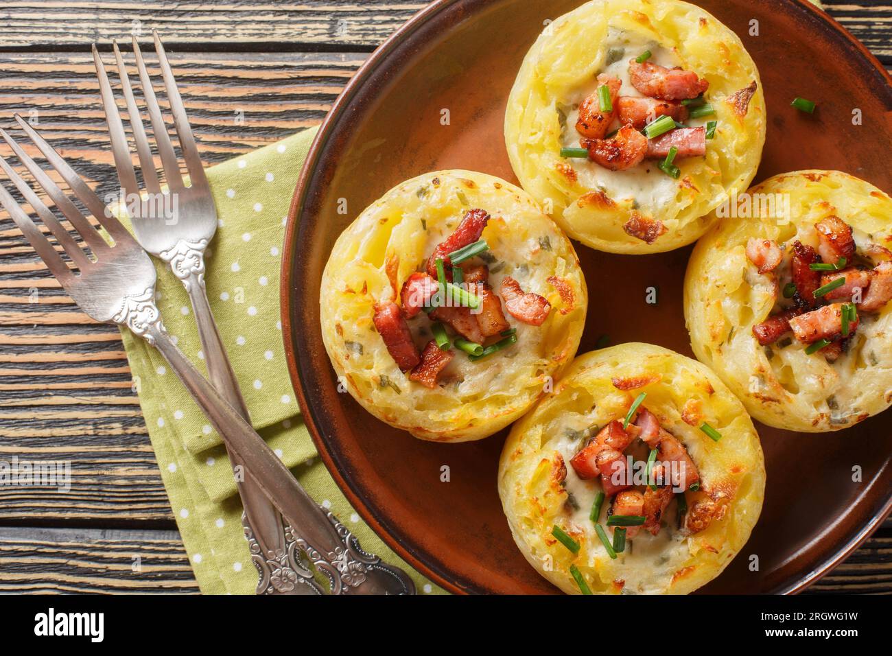 Cheesy Mashed Potato Nests With Bacon And Onion close-up in a plate on ...