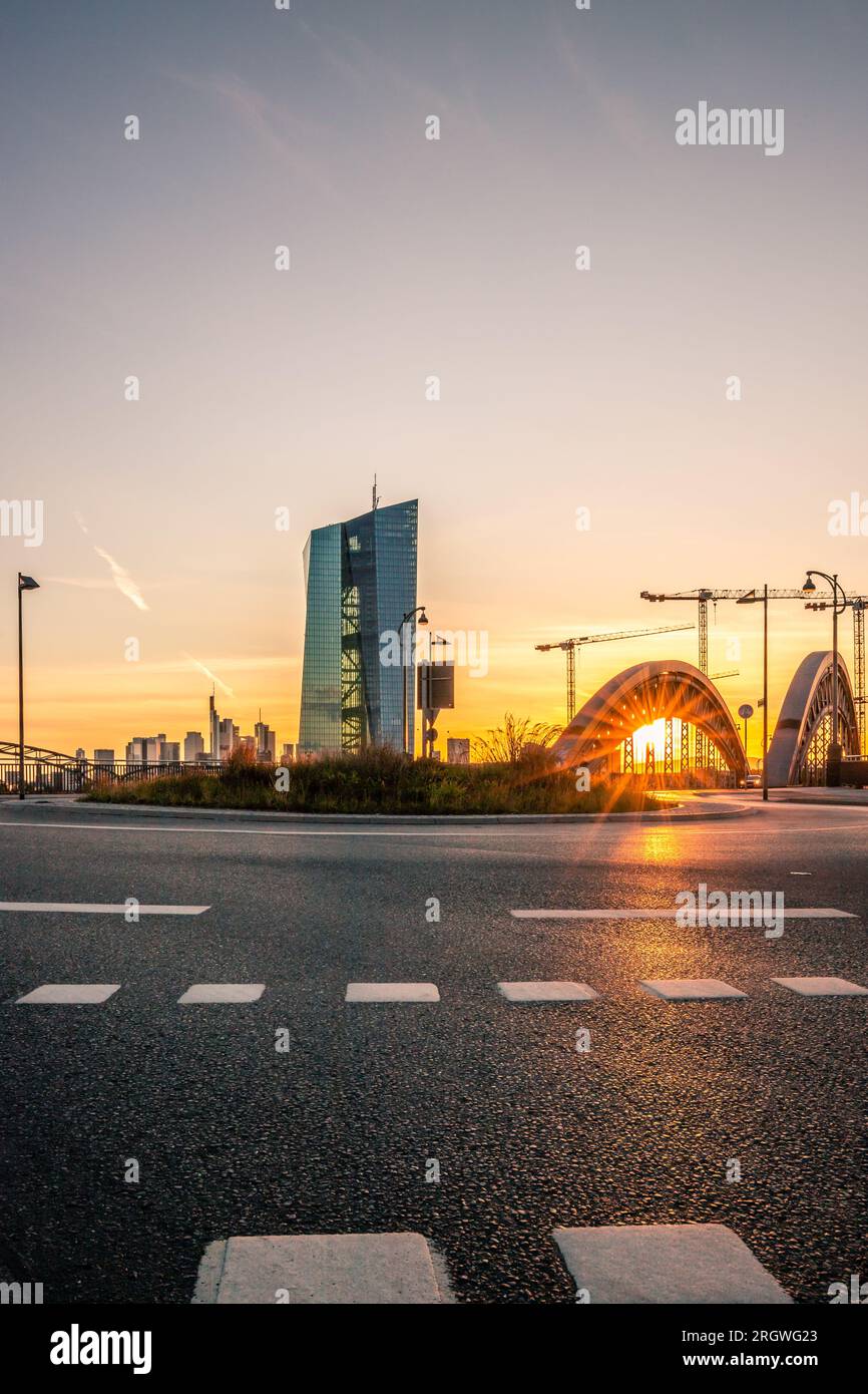 Sunset in Frankfurt am Main. Skyline wedged under a steel bridge. Right ...