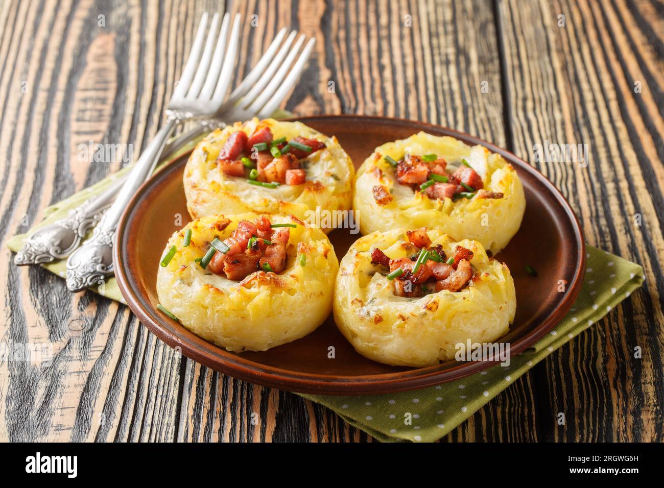 Baked mashed potato nests stuffed with fried bacon, cheese and onions ...