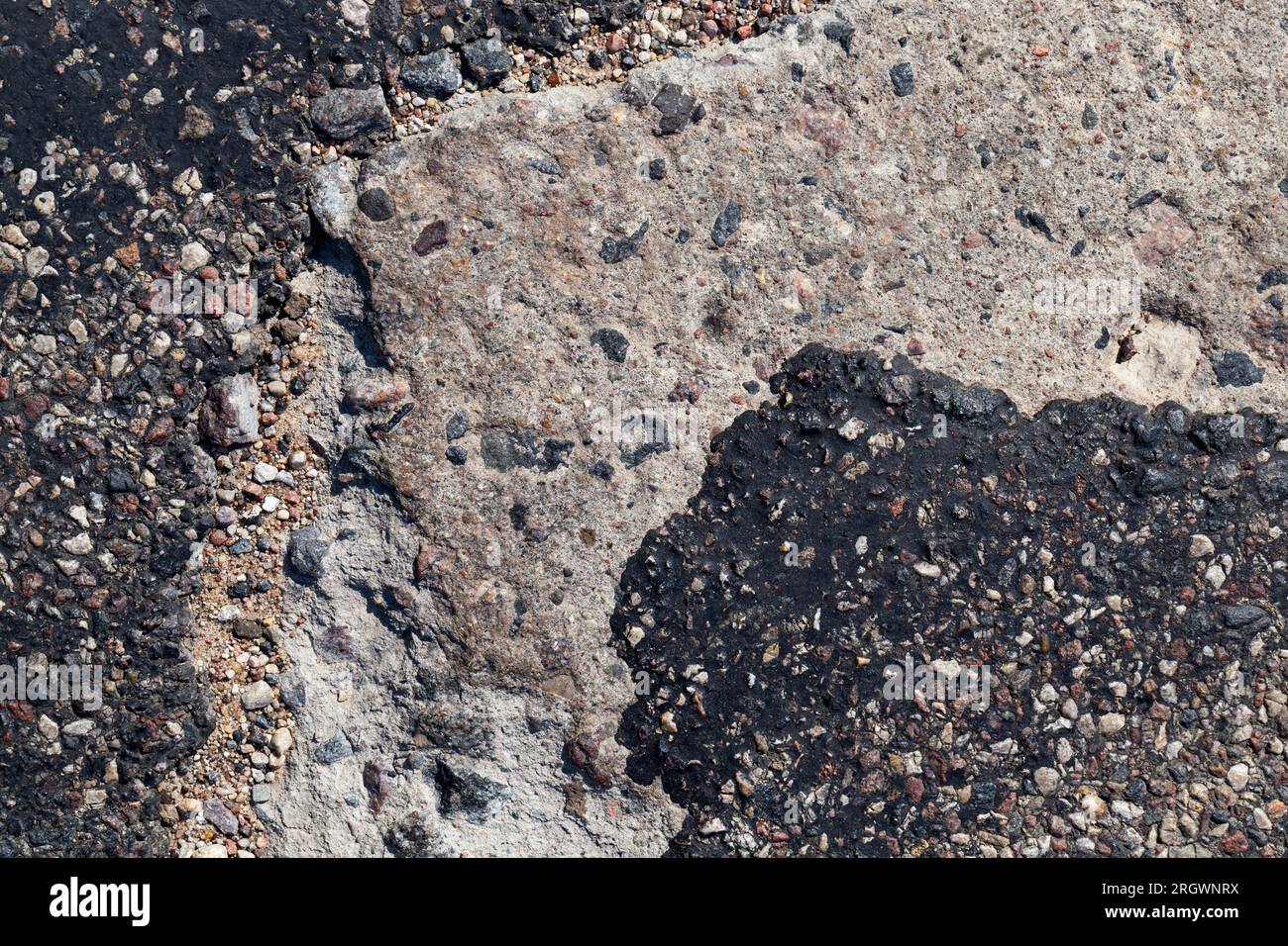 a road of poor quality has been repaired many times, a bad road with ...