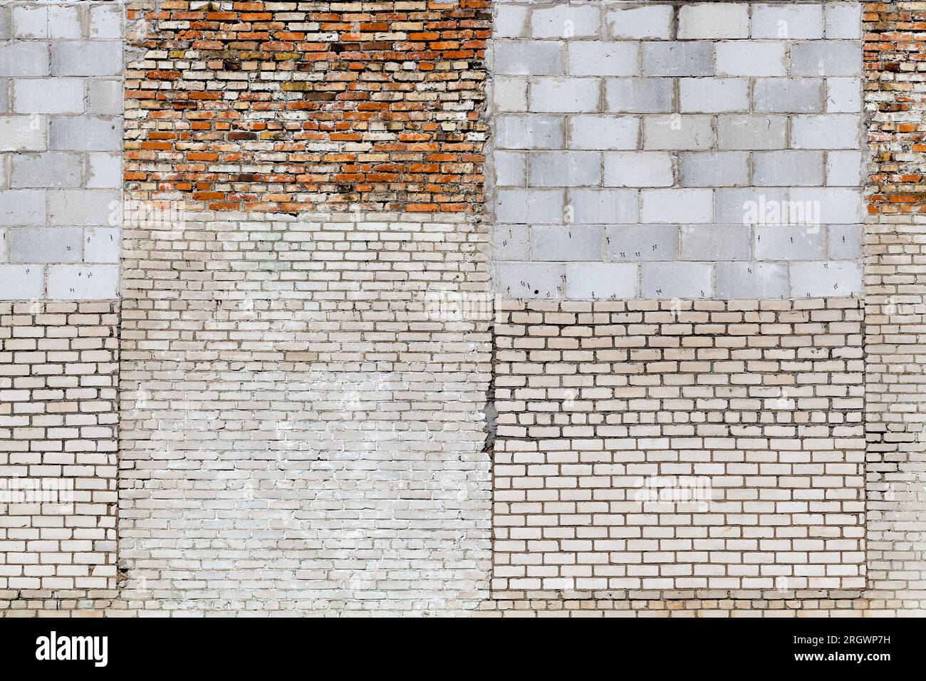 the wall of the building is made of different quality and types of ...