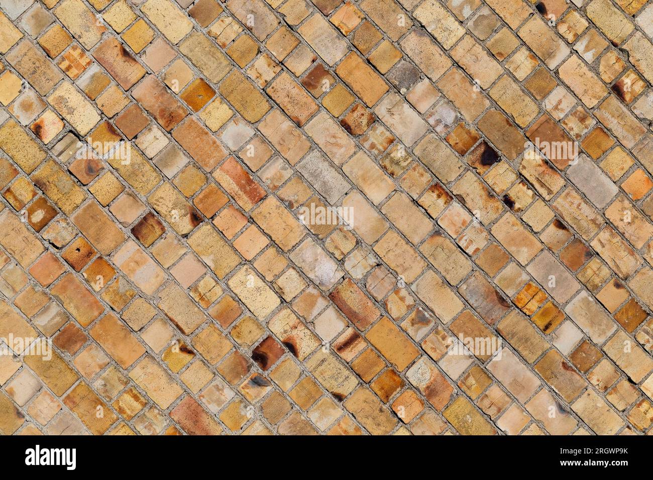 old brick wall of a part of the building, bricks of different shapes ...