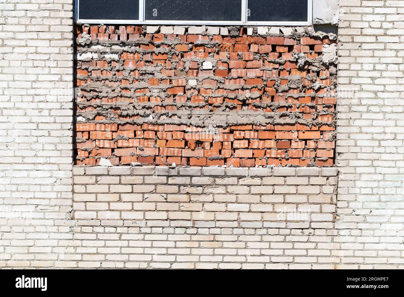 the wall of the building is made of different quality and types of ...