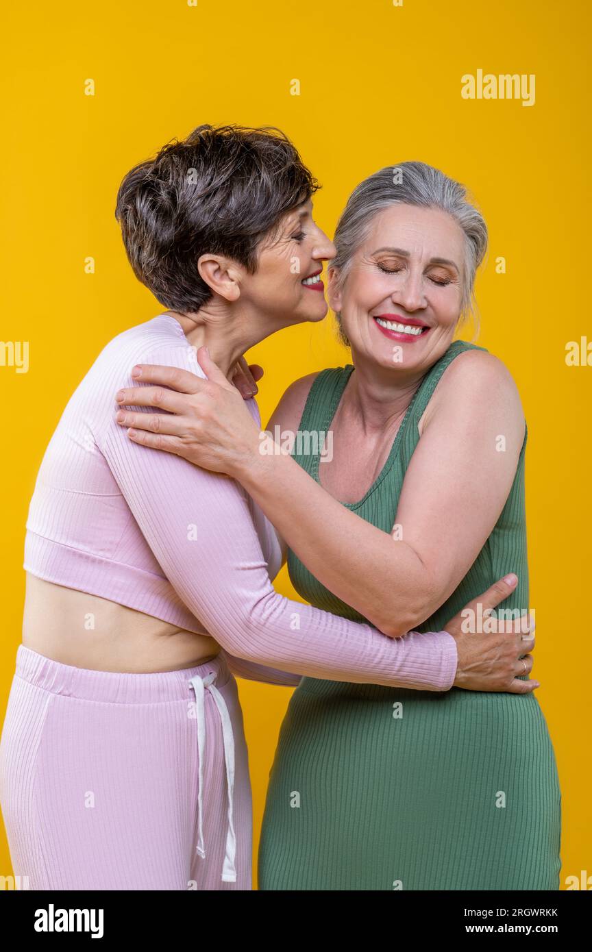 Senior well-groomed women feeling excited and smiling Stock Photo - Alamy