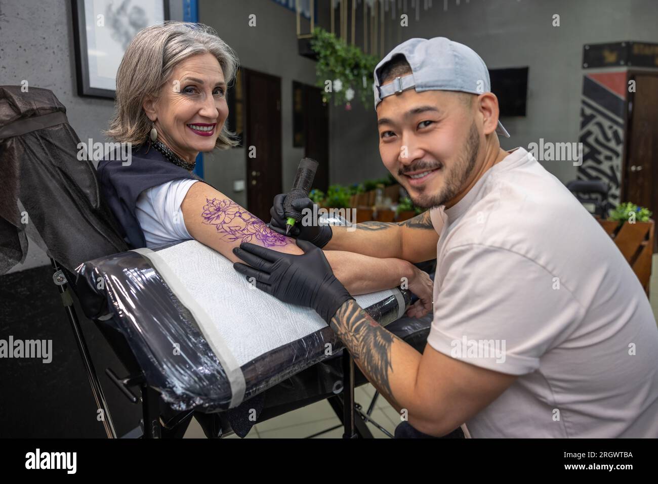 Asian woman tattooed arm hi-res stock photography and images - Alamy