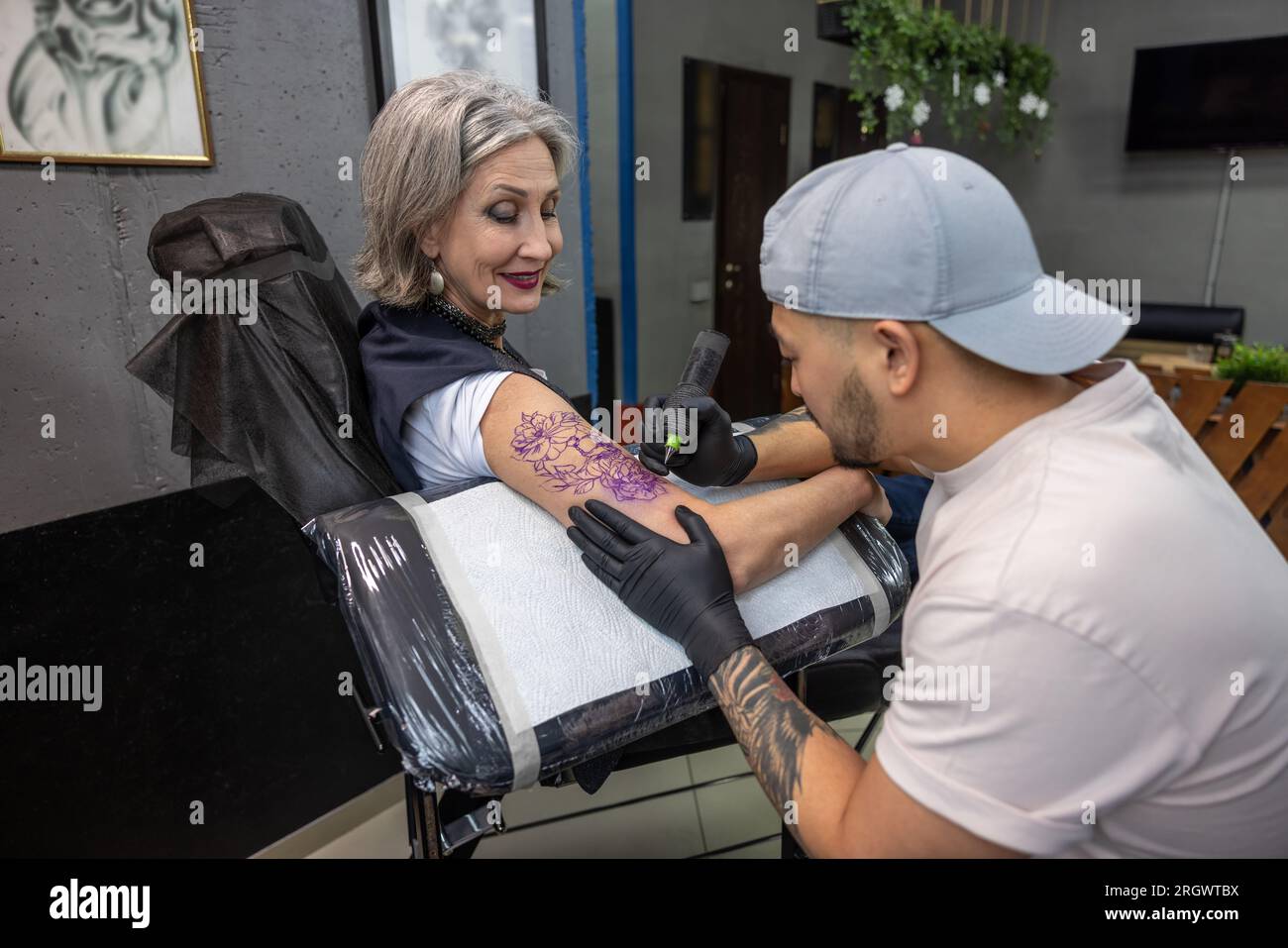 Asian woman tattooed arm hi-res stock photography and images - Alamy