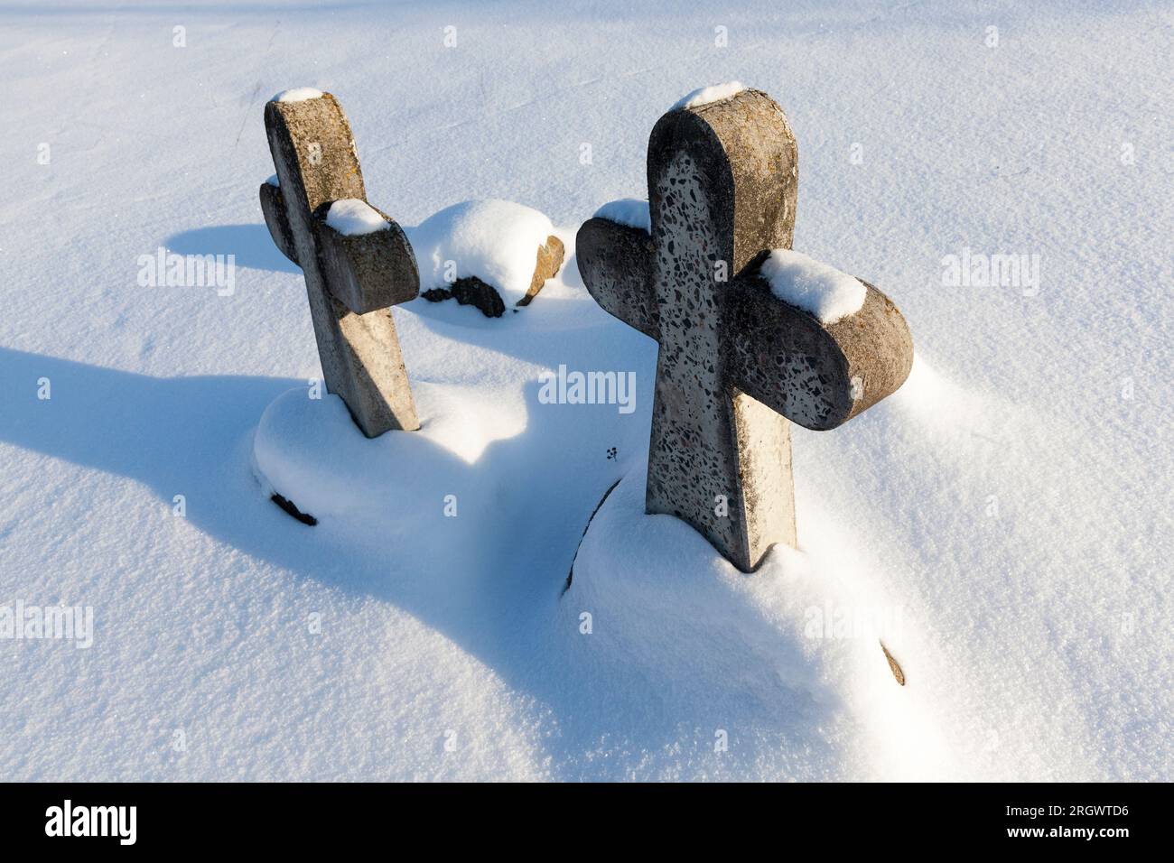 religious crosses in the snow in the winter season, old stone crosses ...
