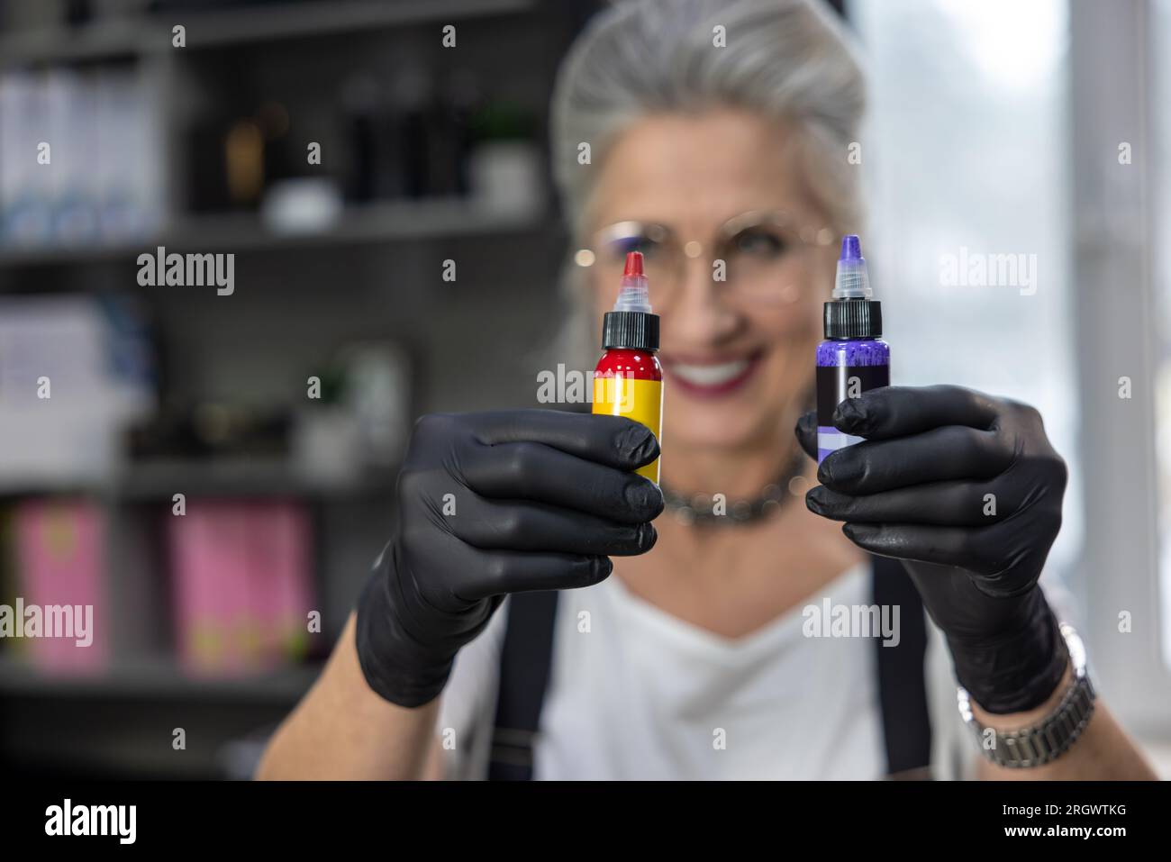 Female tattoo master holding hi-res stock photography and images - Alamy