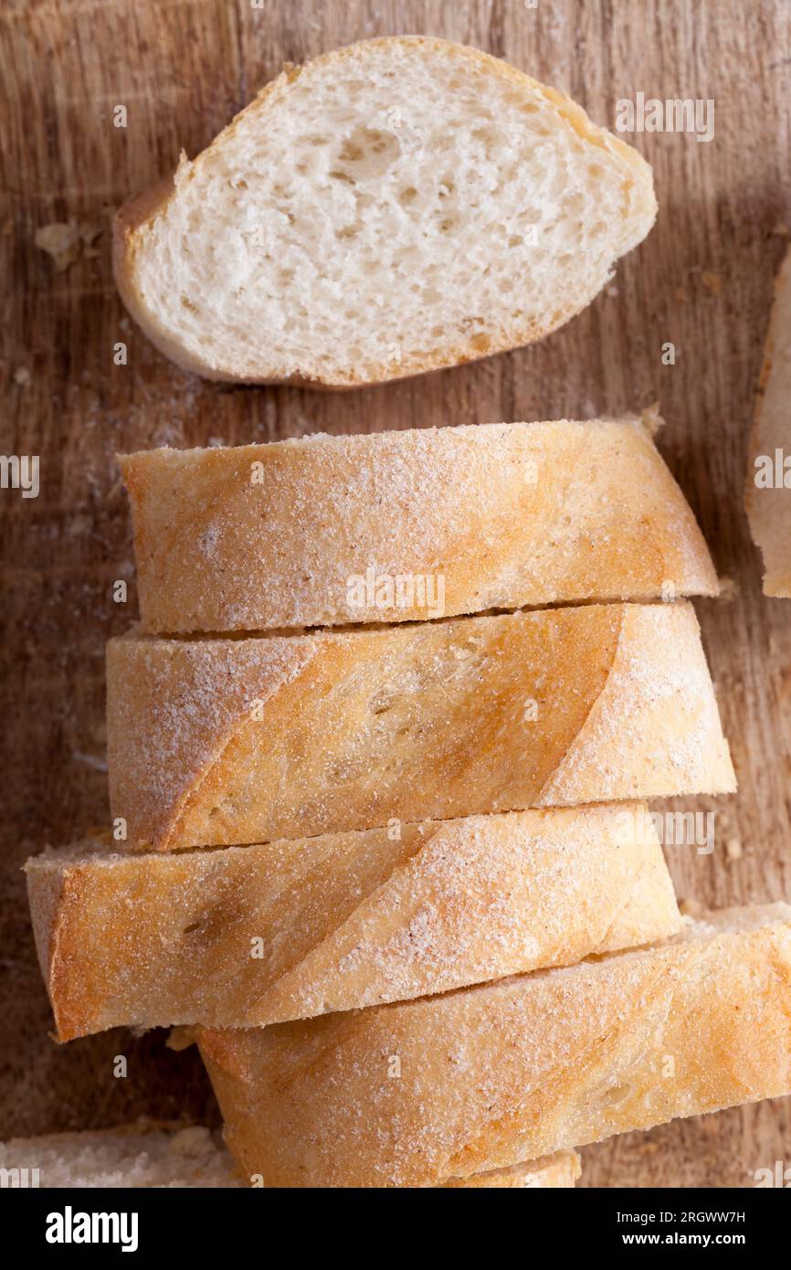 cut white bread into pieces to use for sandwiches Stock Photo - Alamy