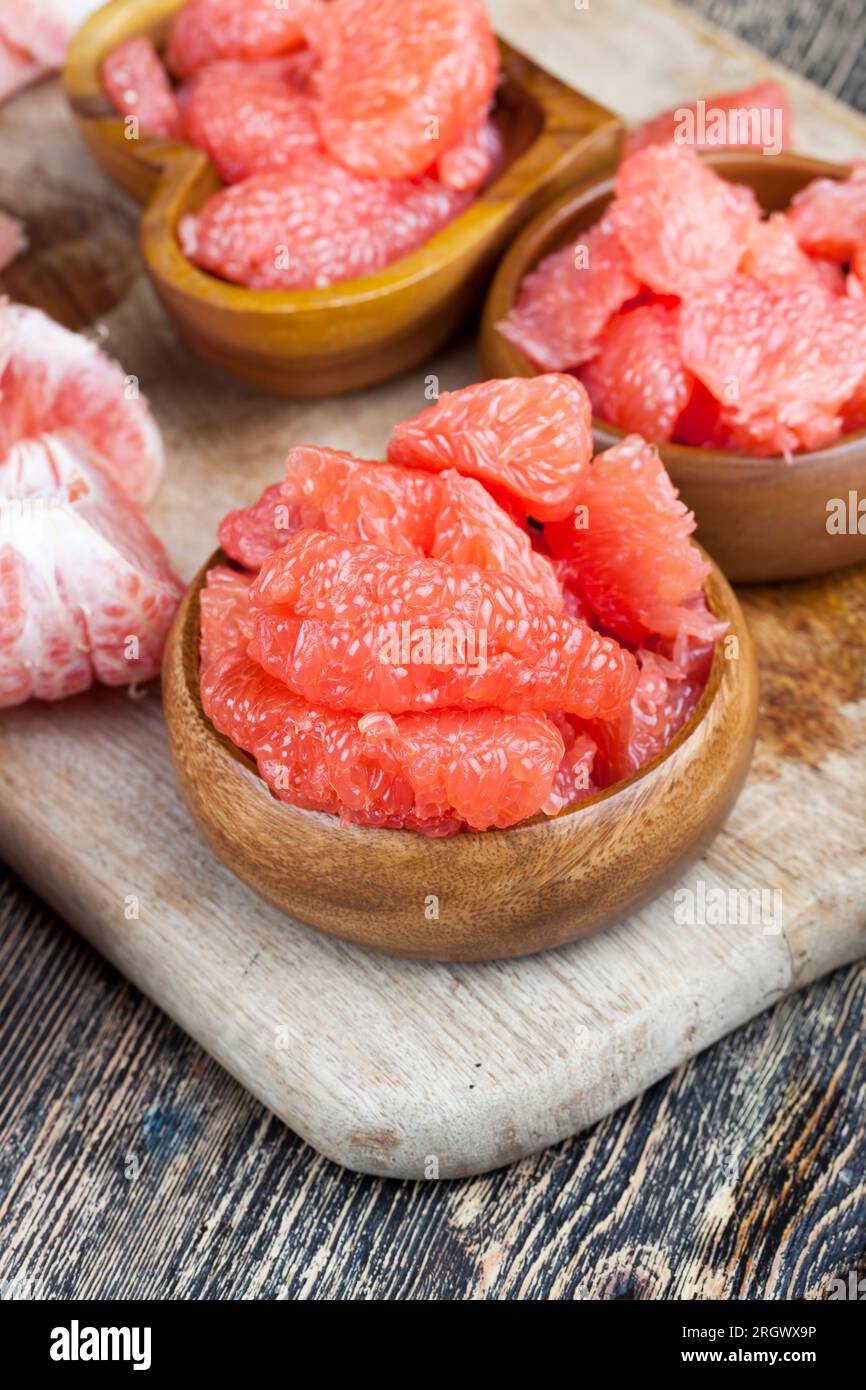 sour ripe grapefruit peeled and divided into slices, pink grapefruit ...