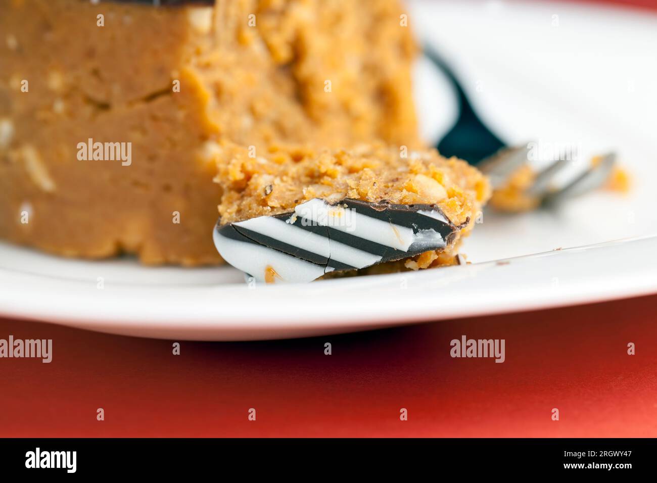 sweet cake in the shape of a cylinder, made of peanuts, sugar and dairy ...