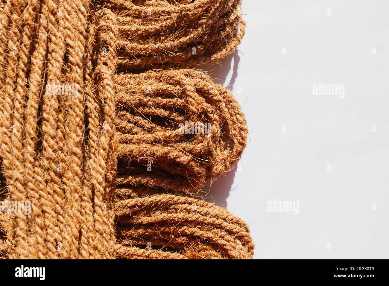 Coconut rope in a pile on white background Stock Photo - Alamy