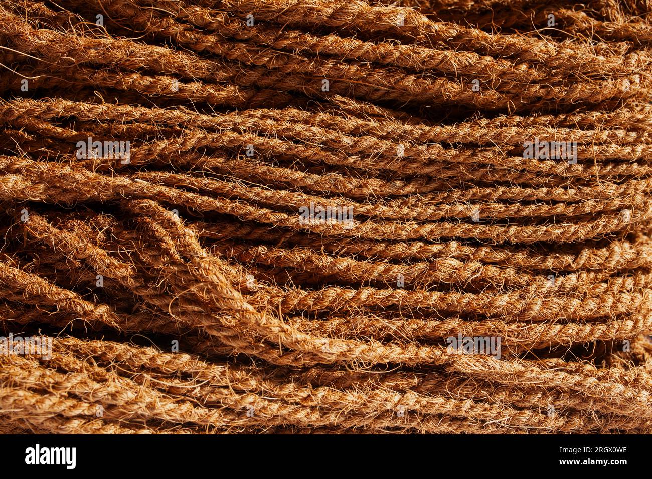 Coconut rope in a pile full frame Stock Photo - Alamy