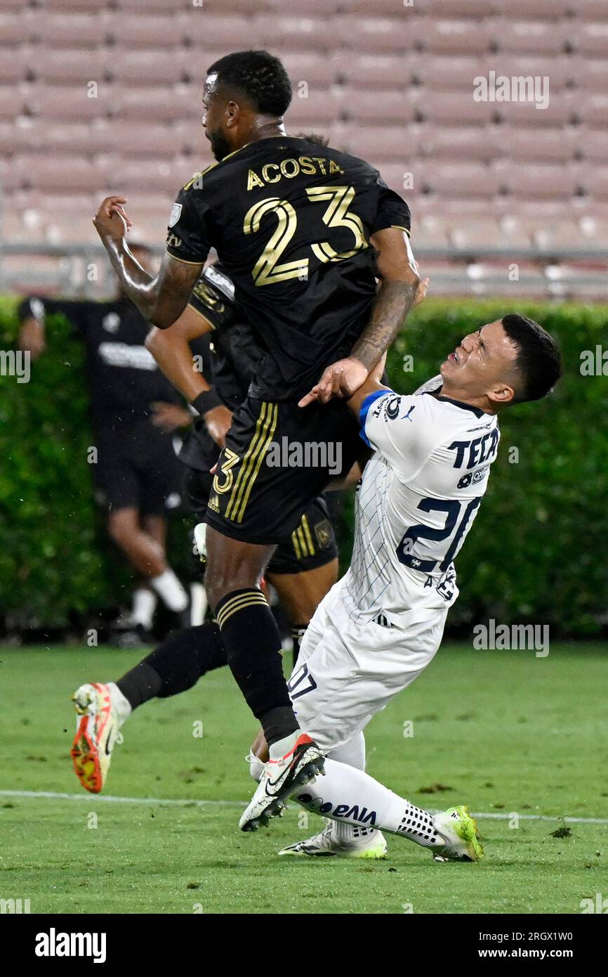 Monterrey forward Ali Avila, right, gets fouled in the box by Los Angeles FC midfielder Kellyn ...