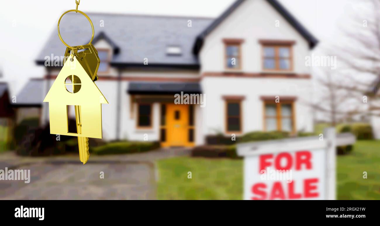 Image of gold house key fob and key, hanging in front of blurred house ...