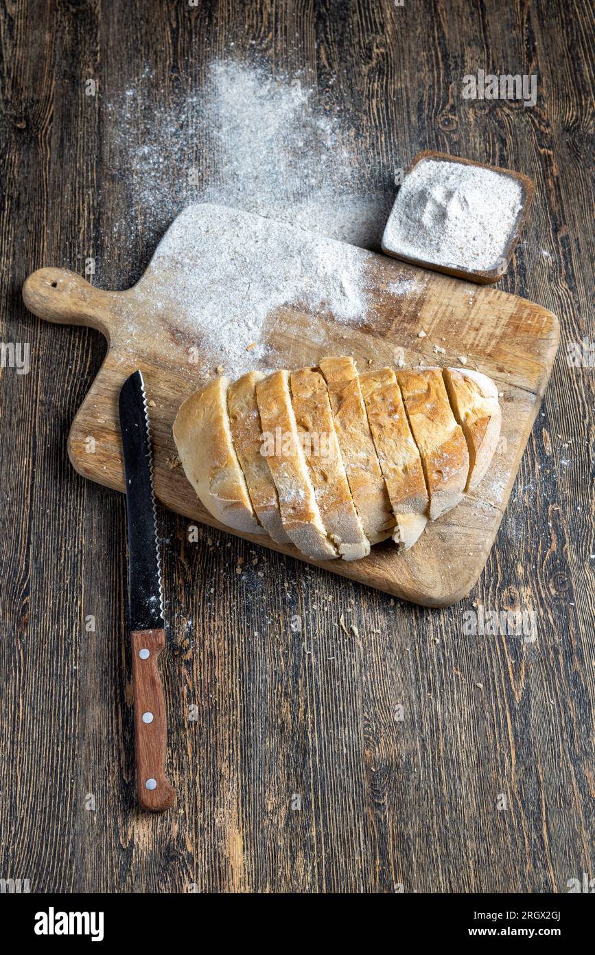 cut fresh bread into pieces while cooking with bread, the bread is cut ...