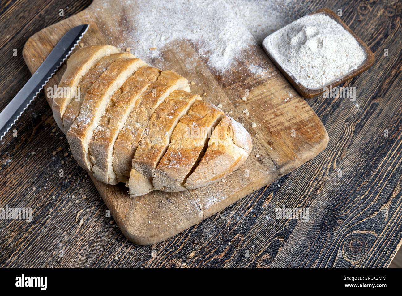 cut fresh bread into pieces while cooking with bread, the bread is cut ...