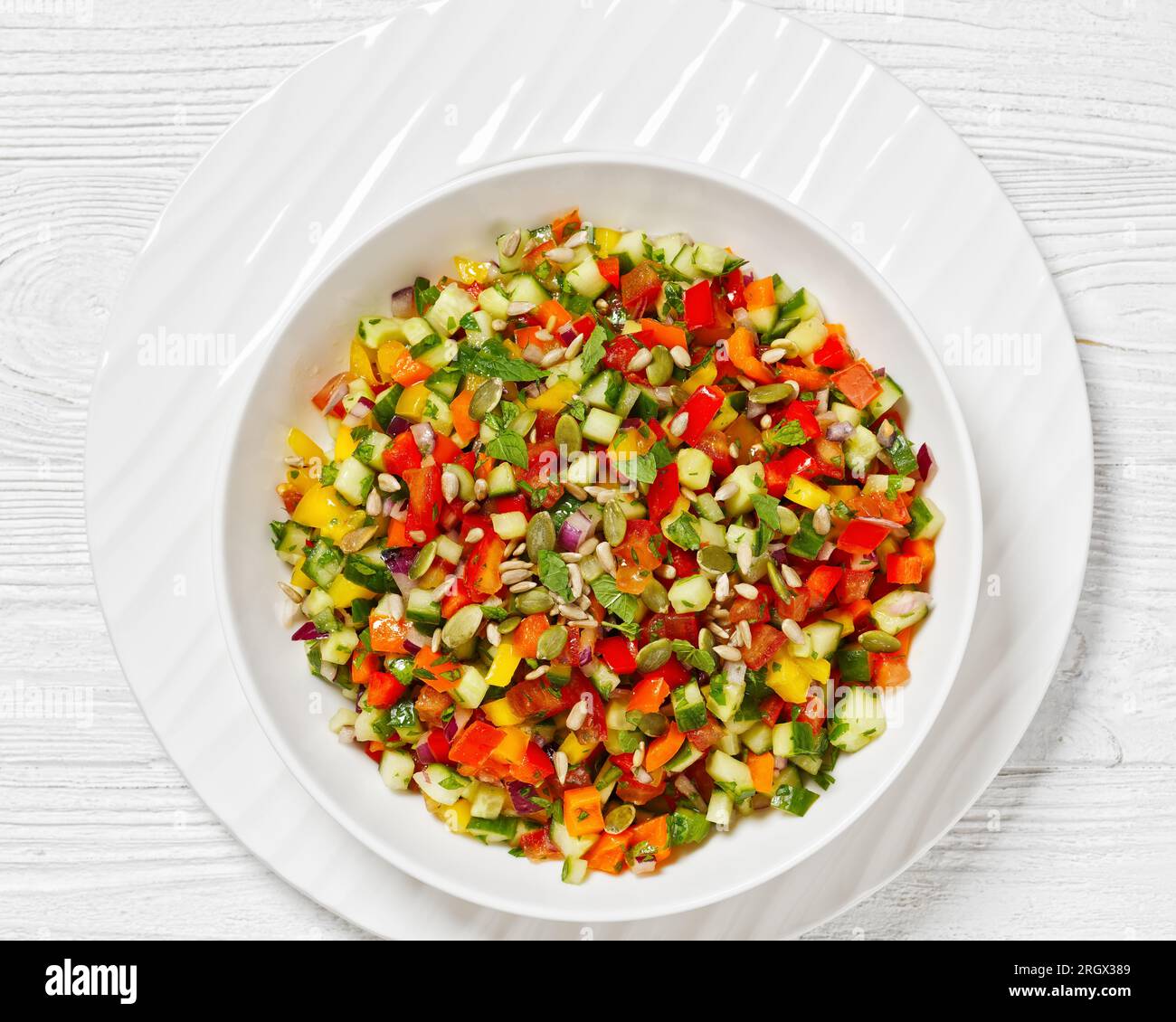 Israeli salad of finely diced tomato, onion, cucumber, and bell peppers ...