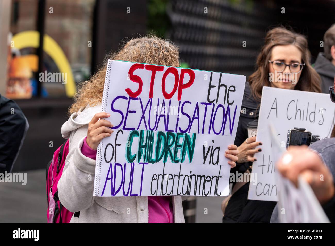Anti-trans protester holds a placard during demonstration about the ...