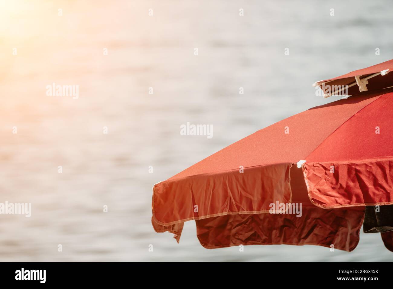Red Beach Umbrella on the Background of the Blue Sea Ocean. Beach ...
