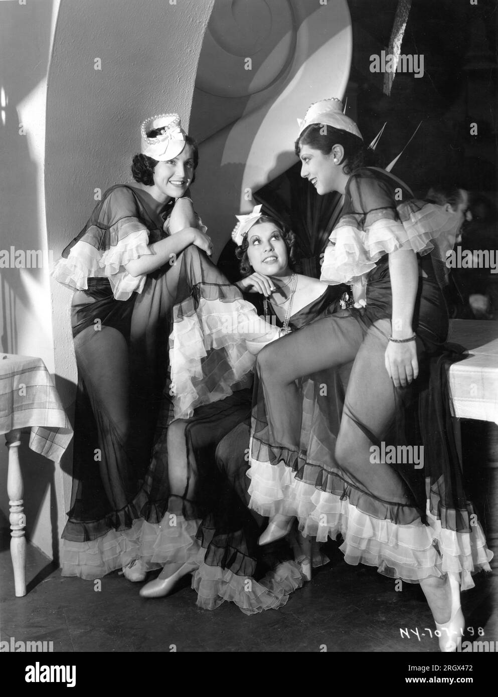 Three Chorines / Chorus Girls on set candid portrait during filming of ...