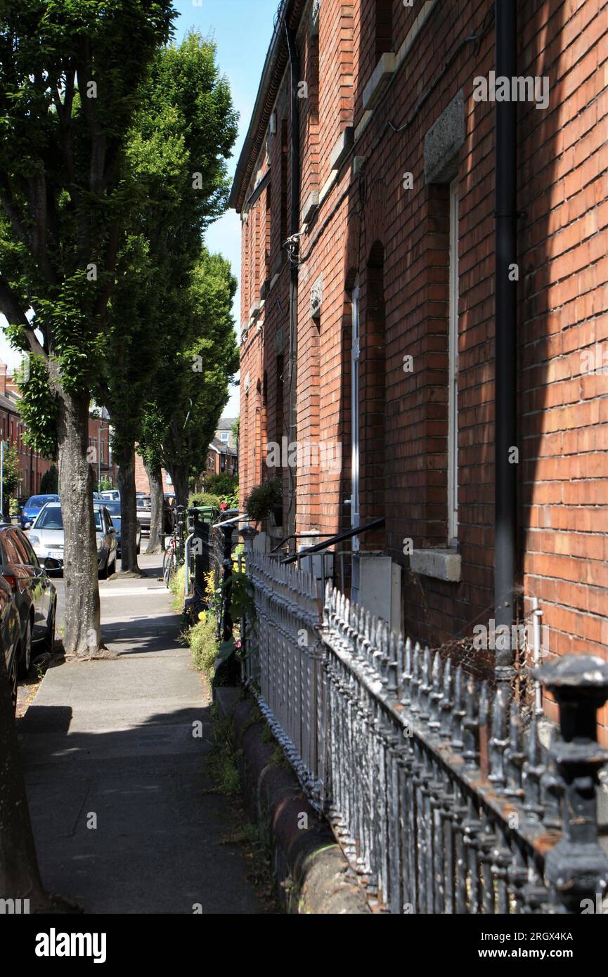 Typical Dublin street, brick building and metal fence. Ireland, Dublin ...