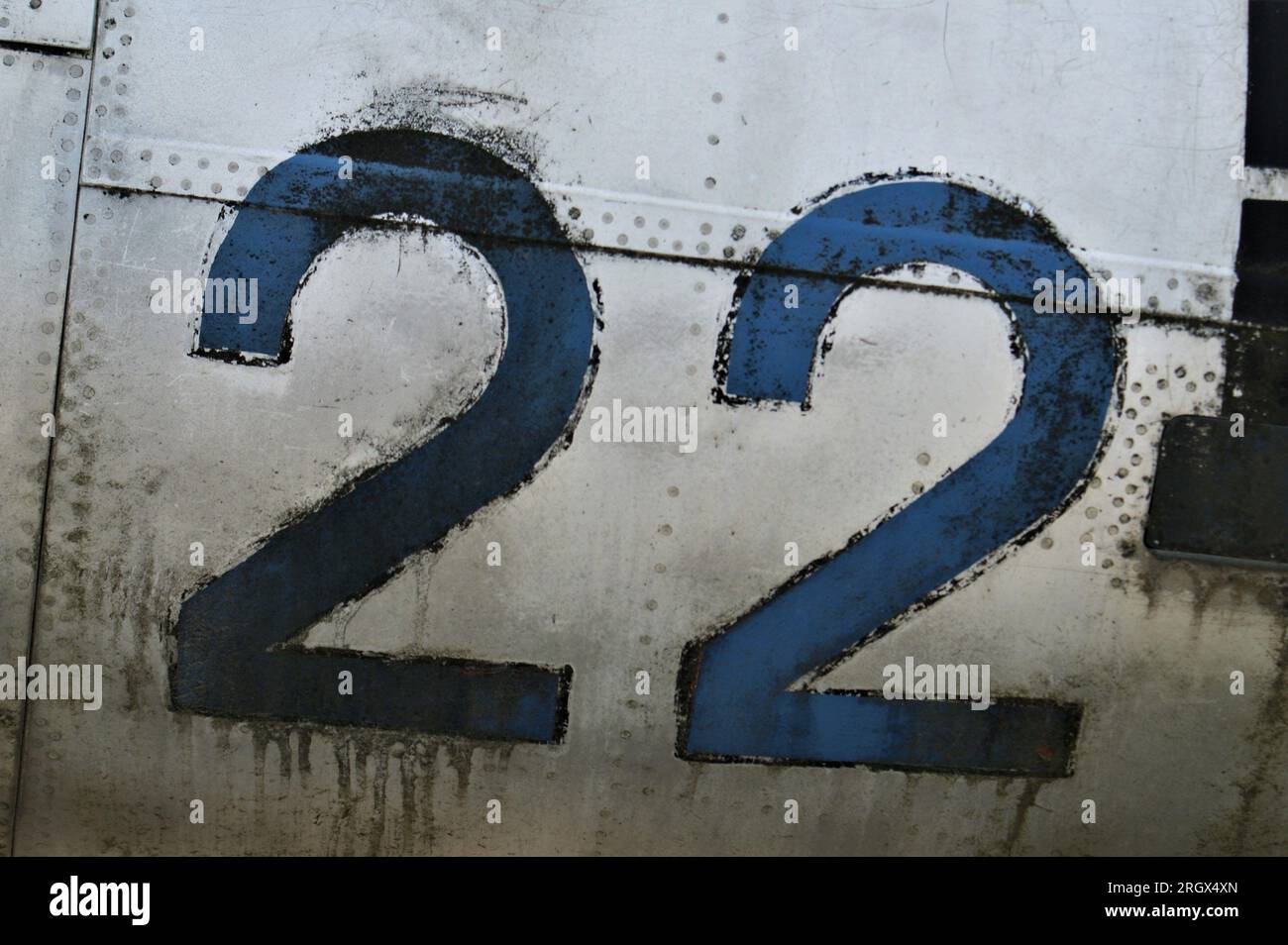 Number 22 written in blue. The number 22 on the fuselage of an old ...