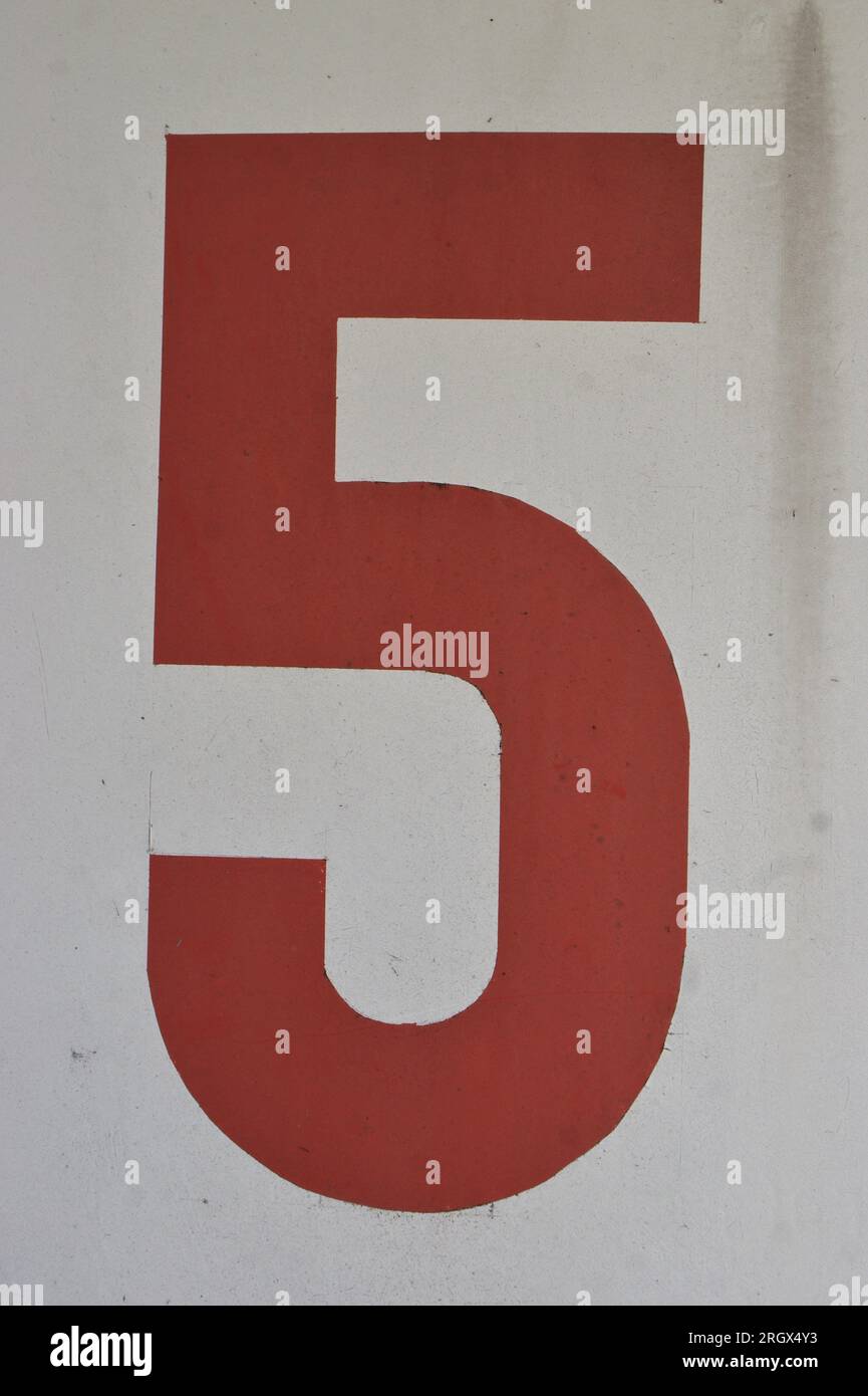 Red number 5. Number five written on a white wall with red paint Stock ...