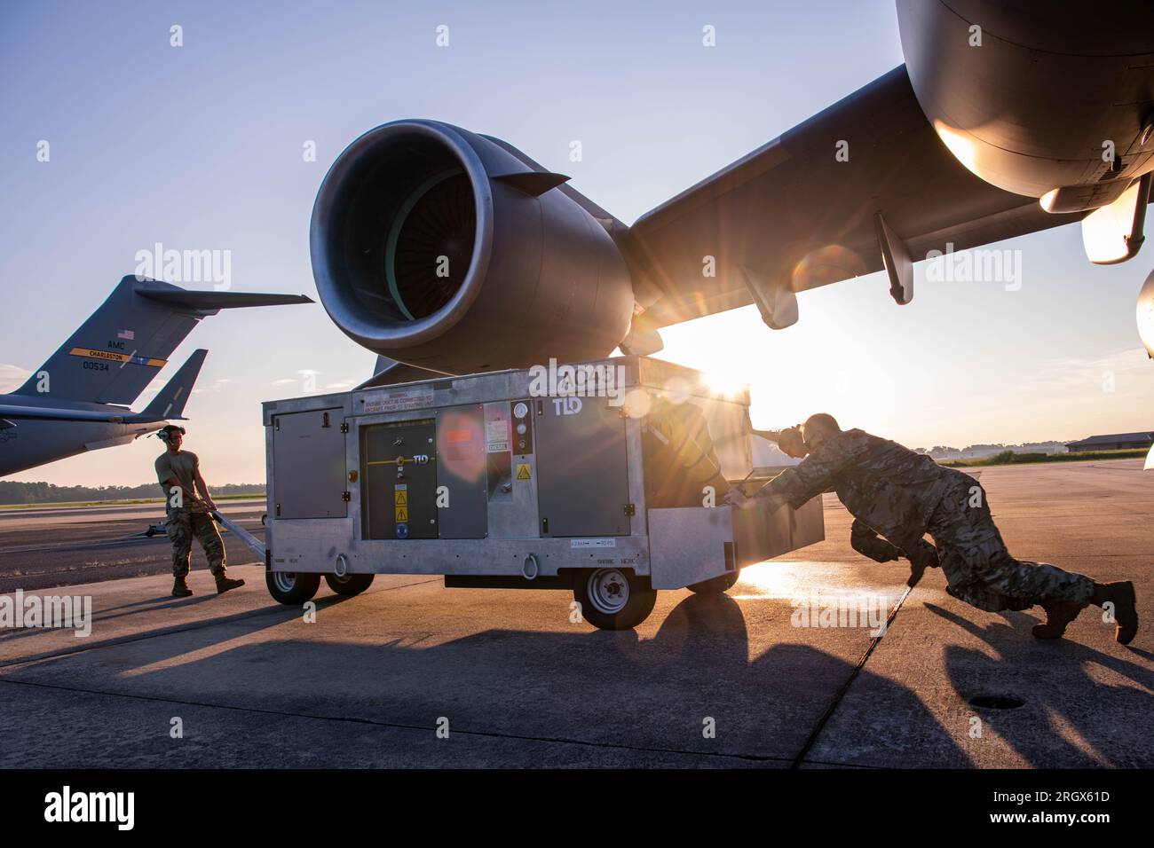 the 315th AMXS, push an AC unit on Joint Base Charleston on Aug. 9 ...