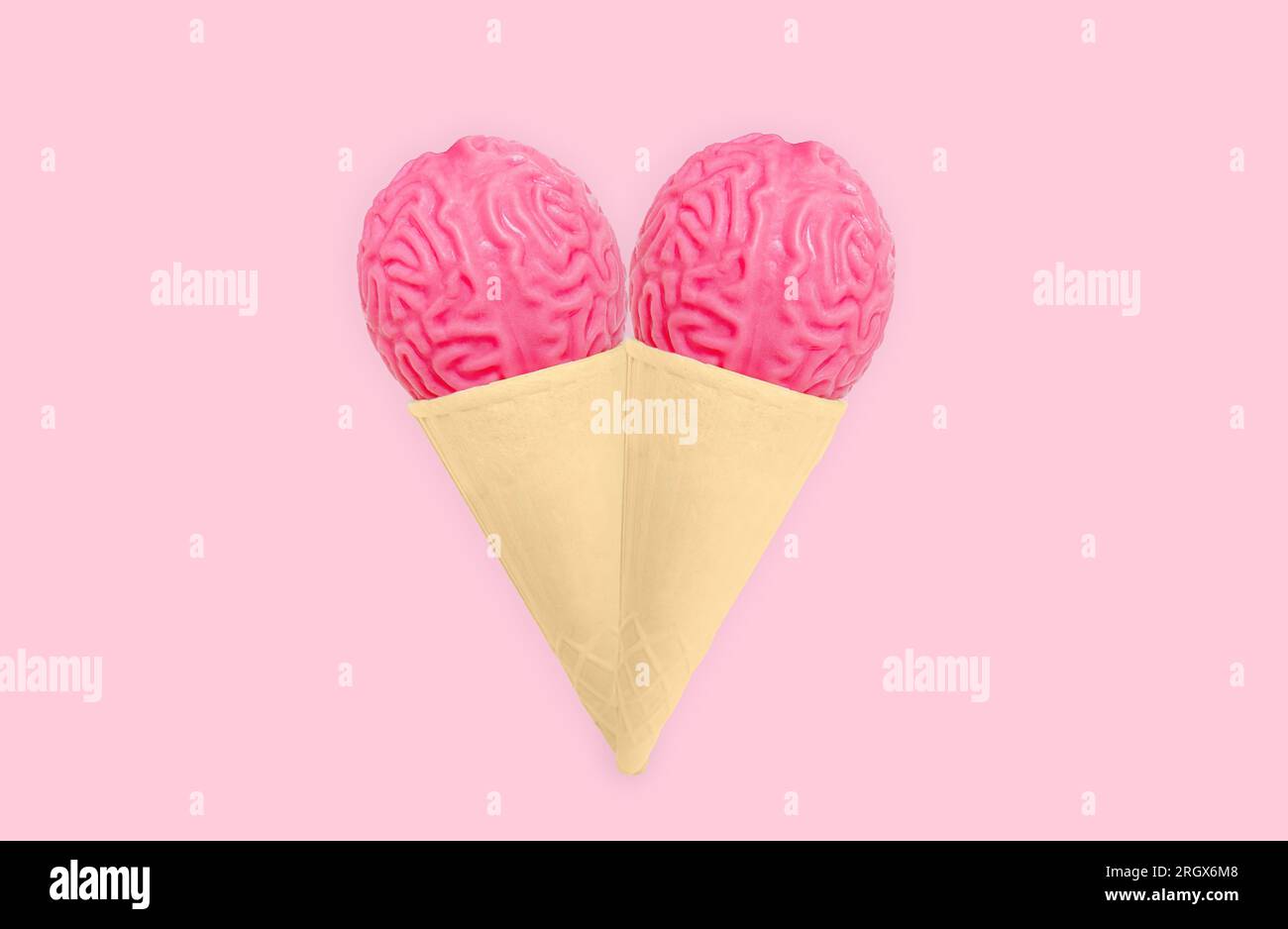 Two ice cream cones with jelly-like human brain models isolated on pink ...