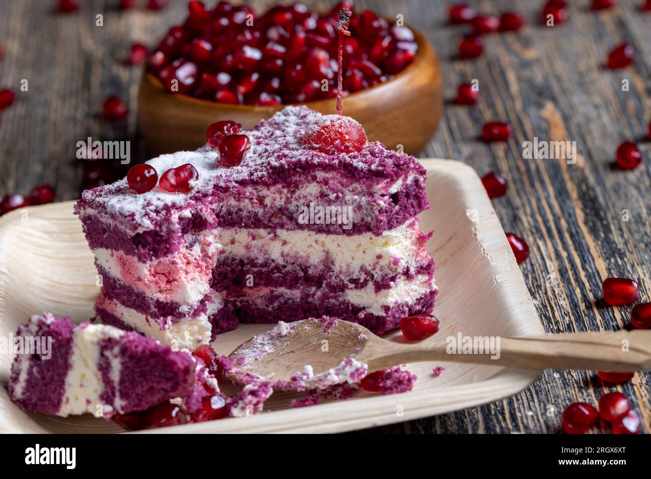 a maroon-colored cake with the taste of different berries and a creamy ...