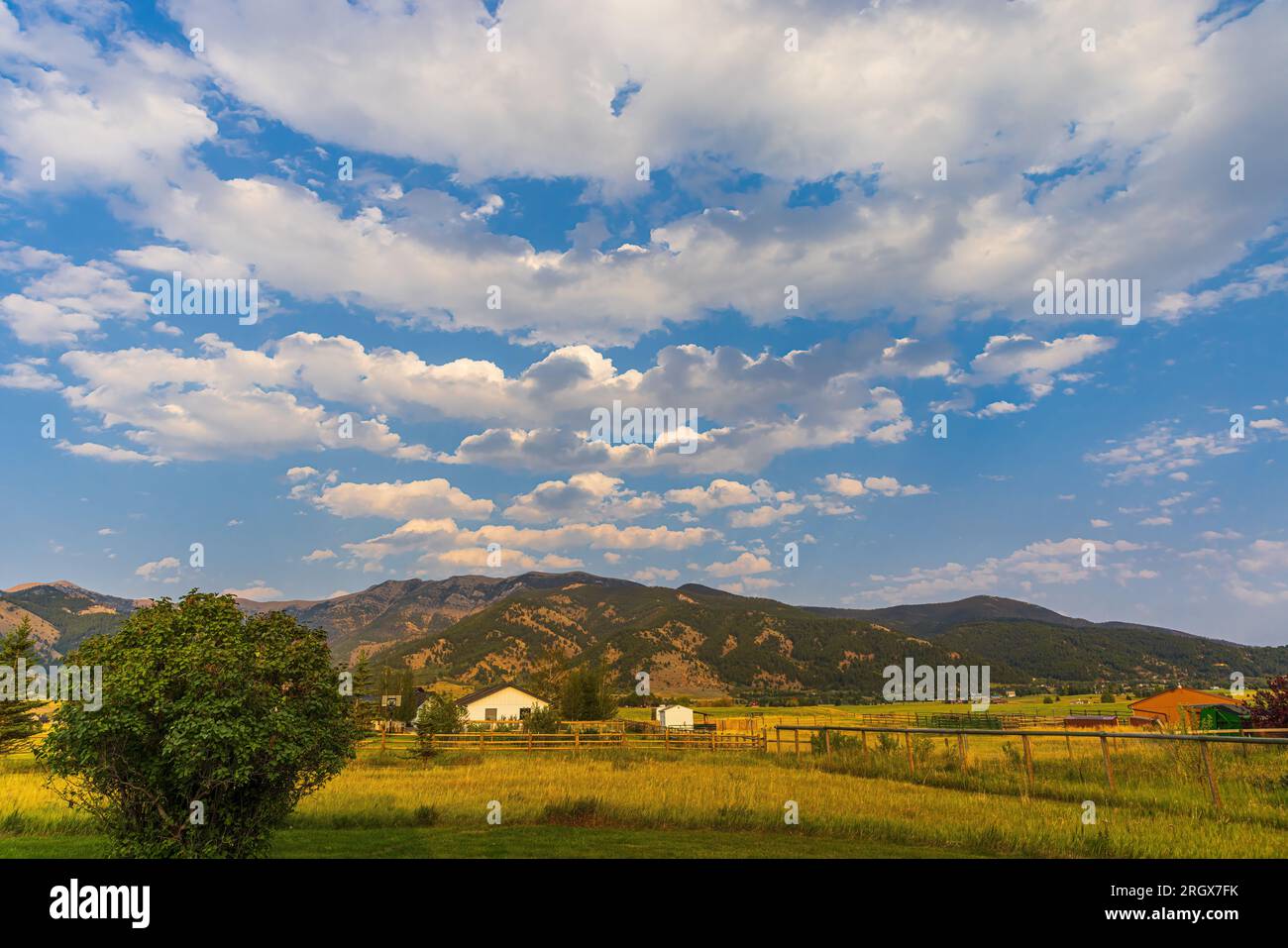 A beautiful view in autumn fields at the foot of a mountain range ion ...