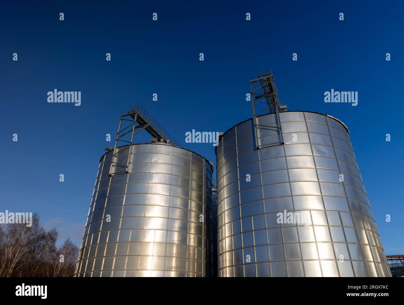 modern metal silo of large size, a silo at an agricultural enterprise ...