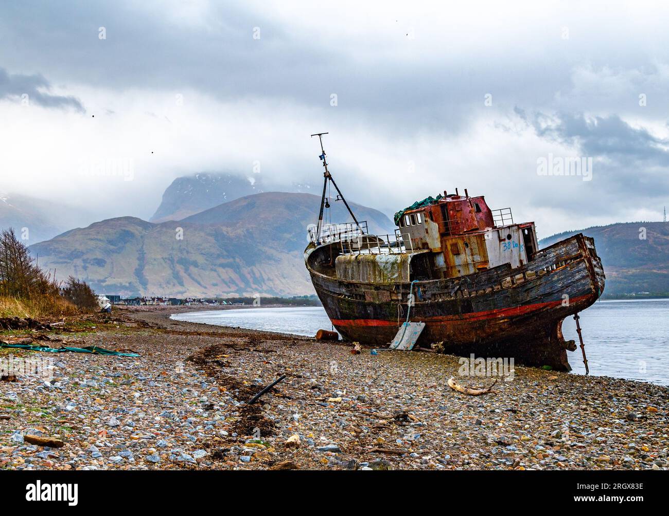 An old beached trawler; the old boat of Caol Stock Photo - Alamy