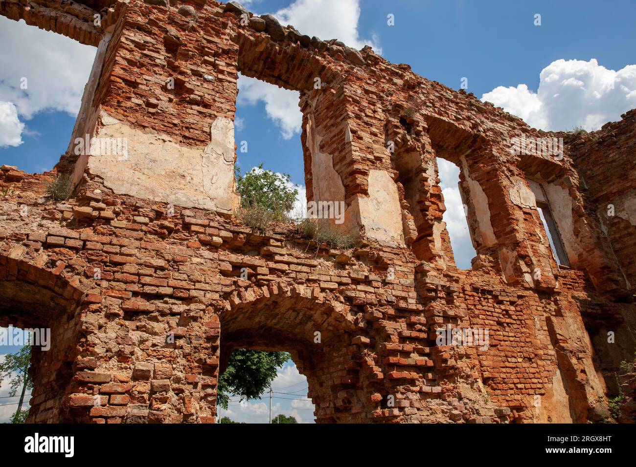 ruins of an ancient red brick castle, ruins of a damaged and abandoned red clay brick castle ...