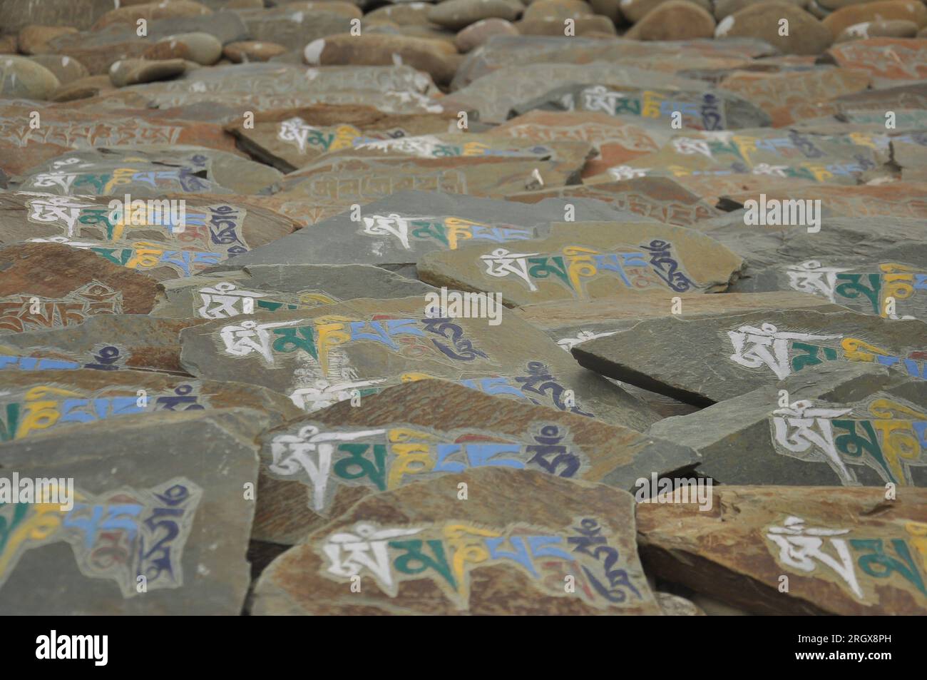 Mani stones with Buddhist mantra "Om Mani Padme Hum" in Zanskar Valley ...
