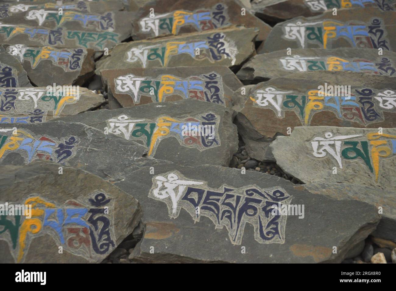 Mani stones with Buddhist mantra "Om Mani Padme Hum" in Zanskar Valley ...