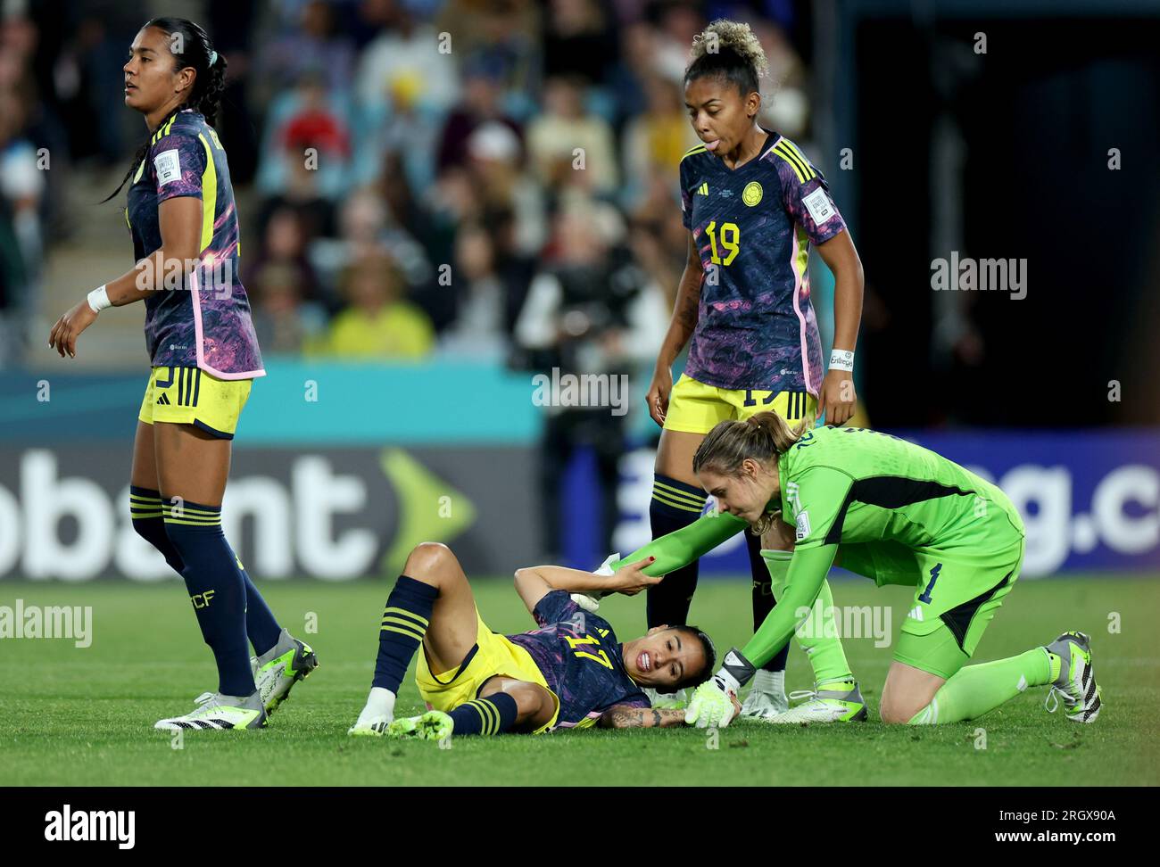 Colombia's Carolina Arias (centre) is checked by team-mates after going ...