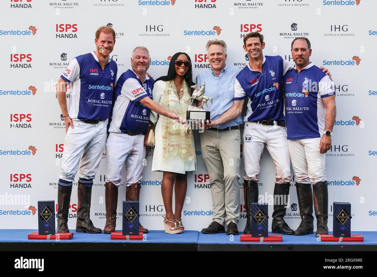 Britain's Prince Harry, left, and and his Royal Salute Sentebale team ...