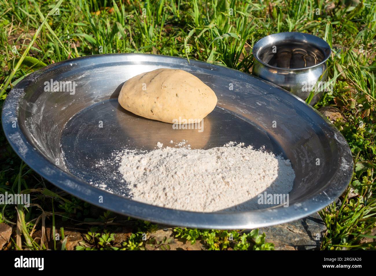 Creating wheat dough for outdoor Roti-making amid Uttarakhand's natural ...