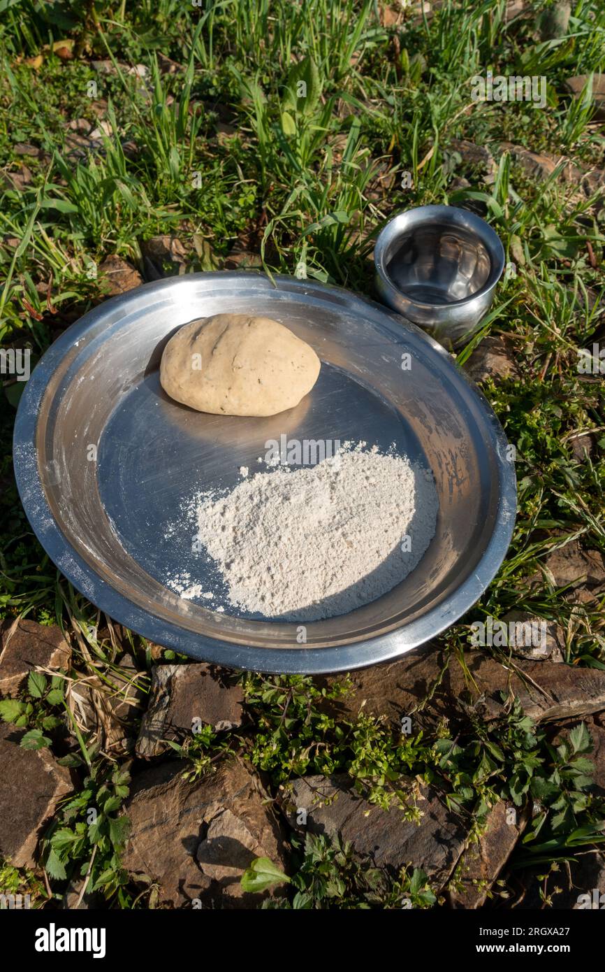 Creating wheat dough for outdoor Roti-making amid Uttarakhand's natural ...